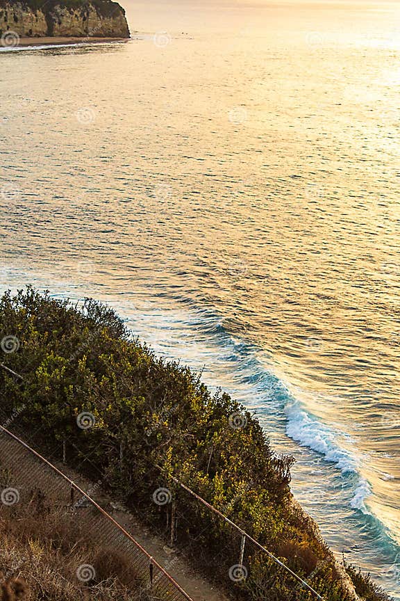 Cliffside View of Ocean Wave Breaking Beneath Path Stock Image - Image ...