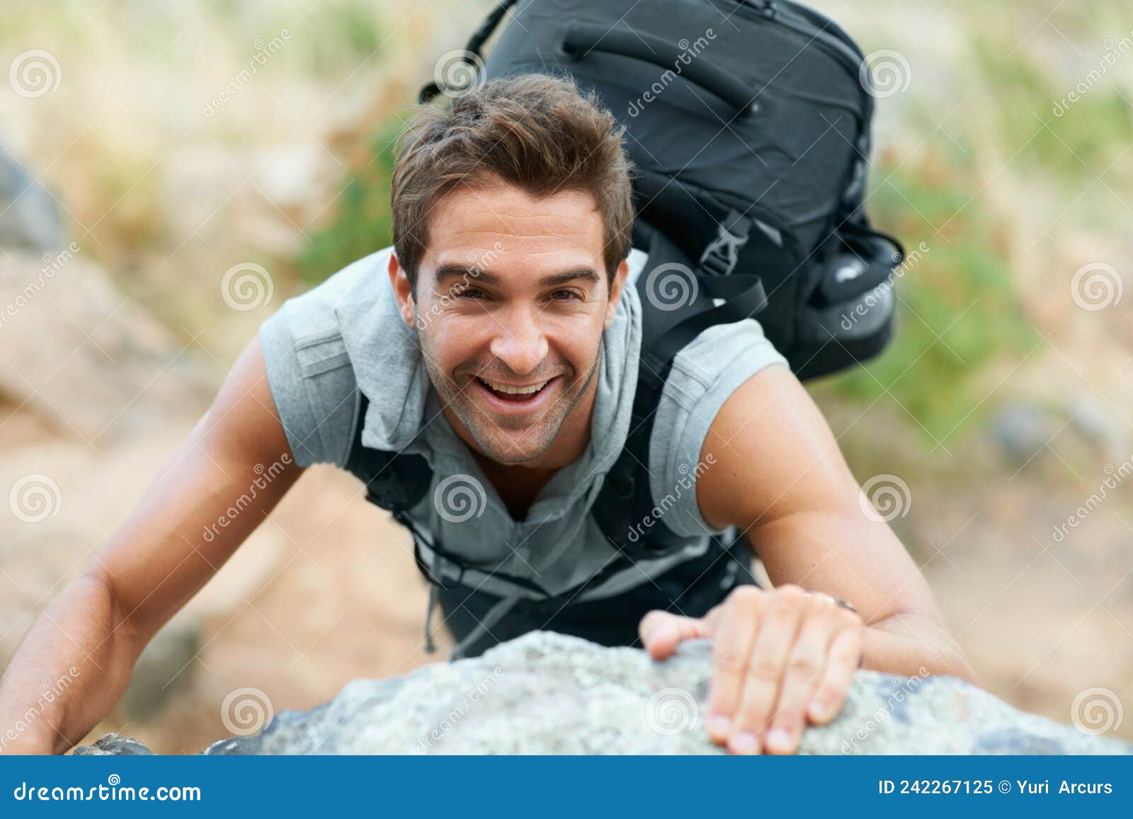 Climb Every Mountain. Young Mountain Climber Smiling Up at the Camera ...