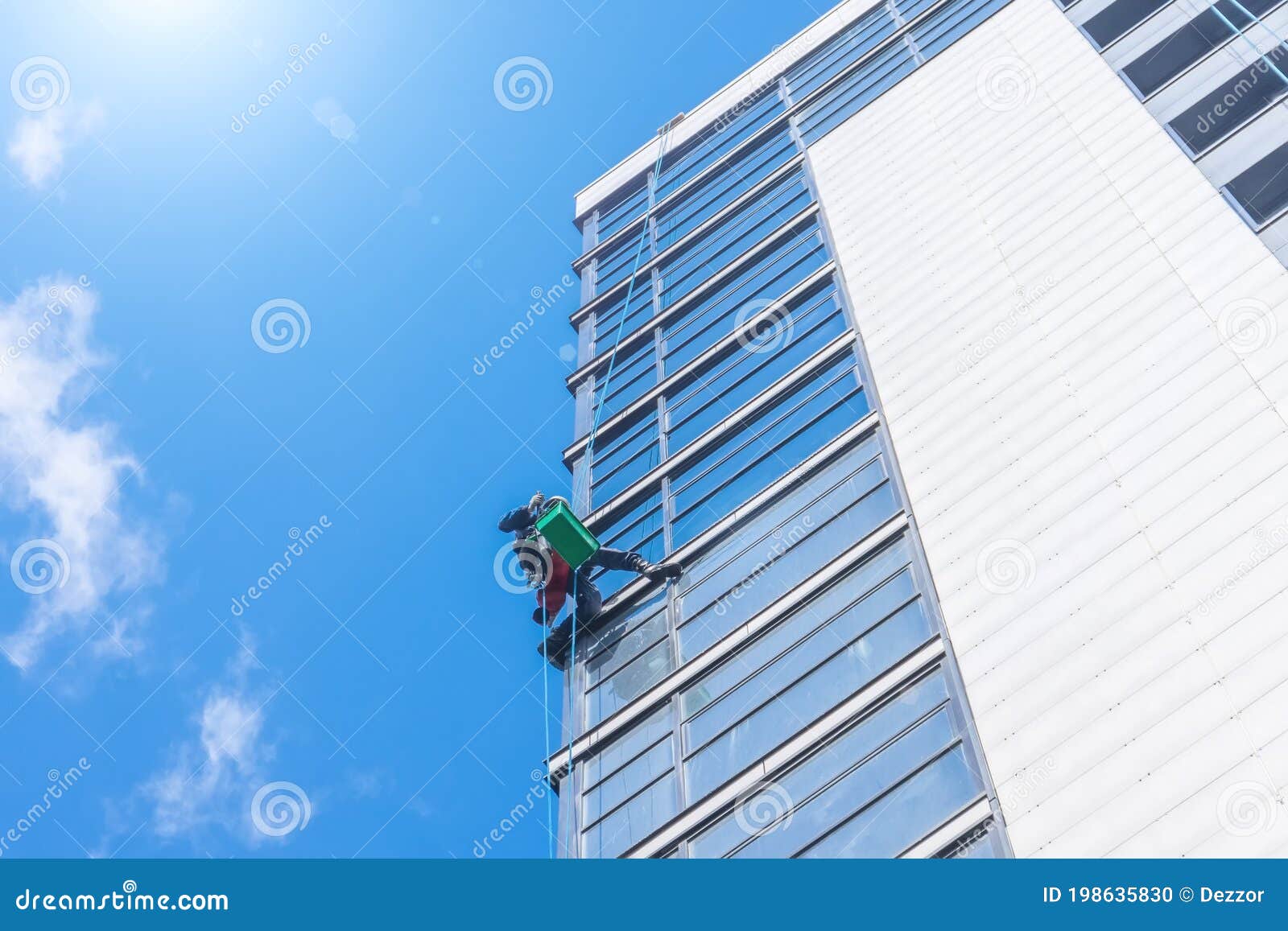 Climber Who Clean The Facade Of The High Rise Building. HSE, Health ...