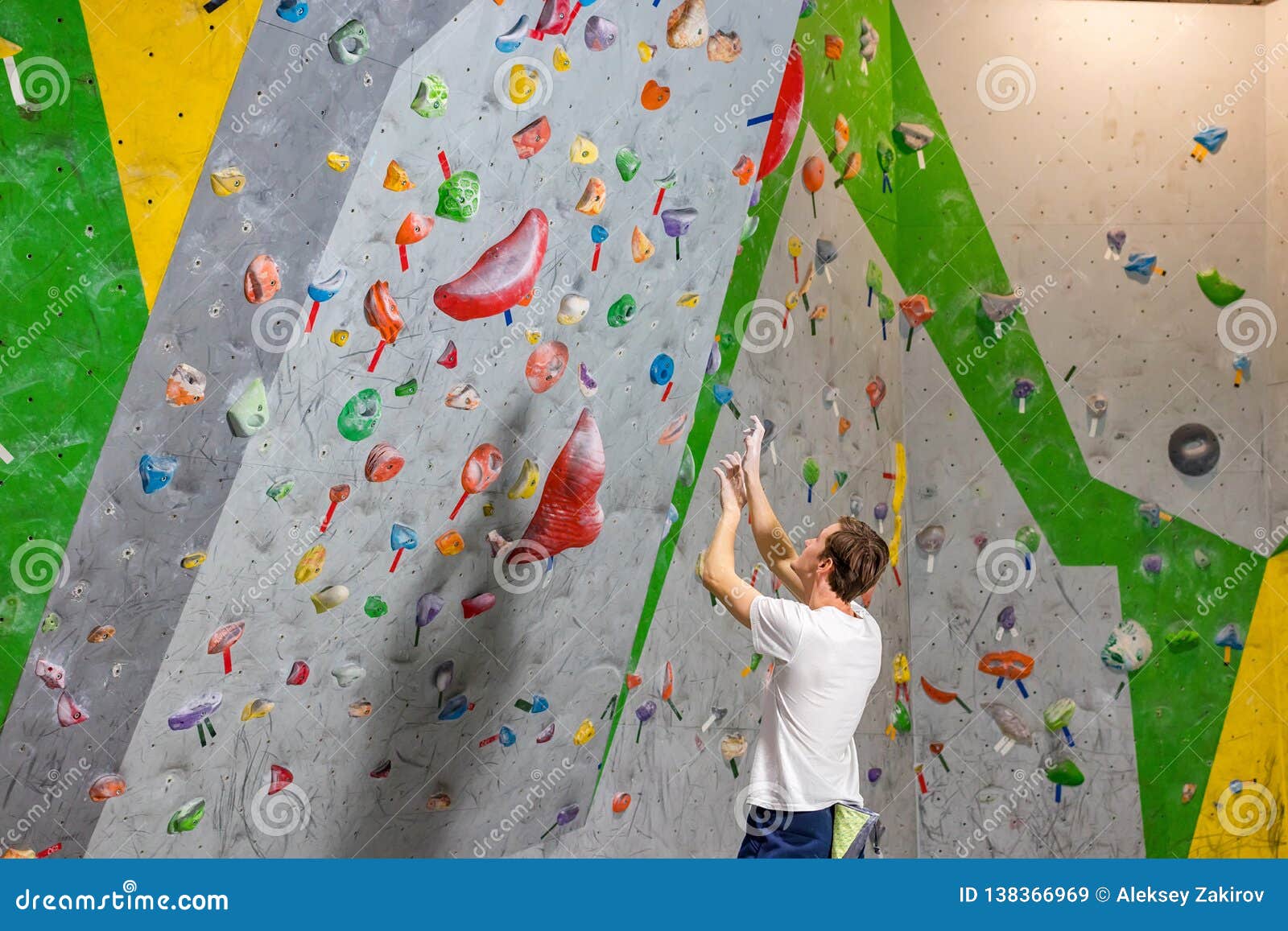 Climber Explores and Develops a Route on a Climbing Wall in the Boulder ...