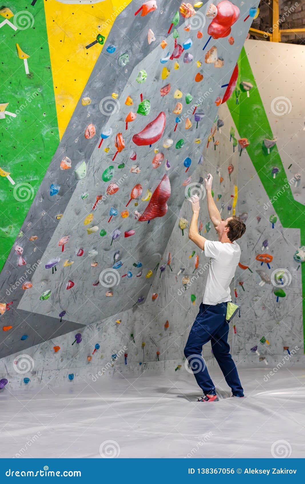 Climber Explores and Develops a Route on a Climbing Wall in the Boulder ...