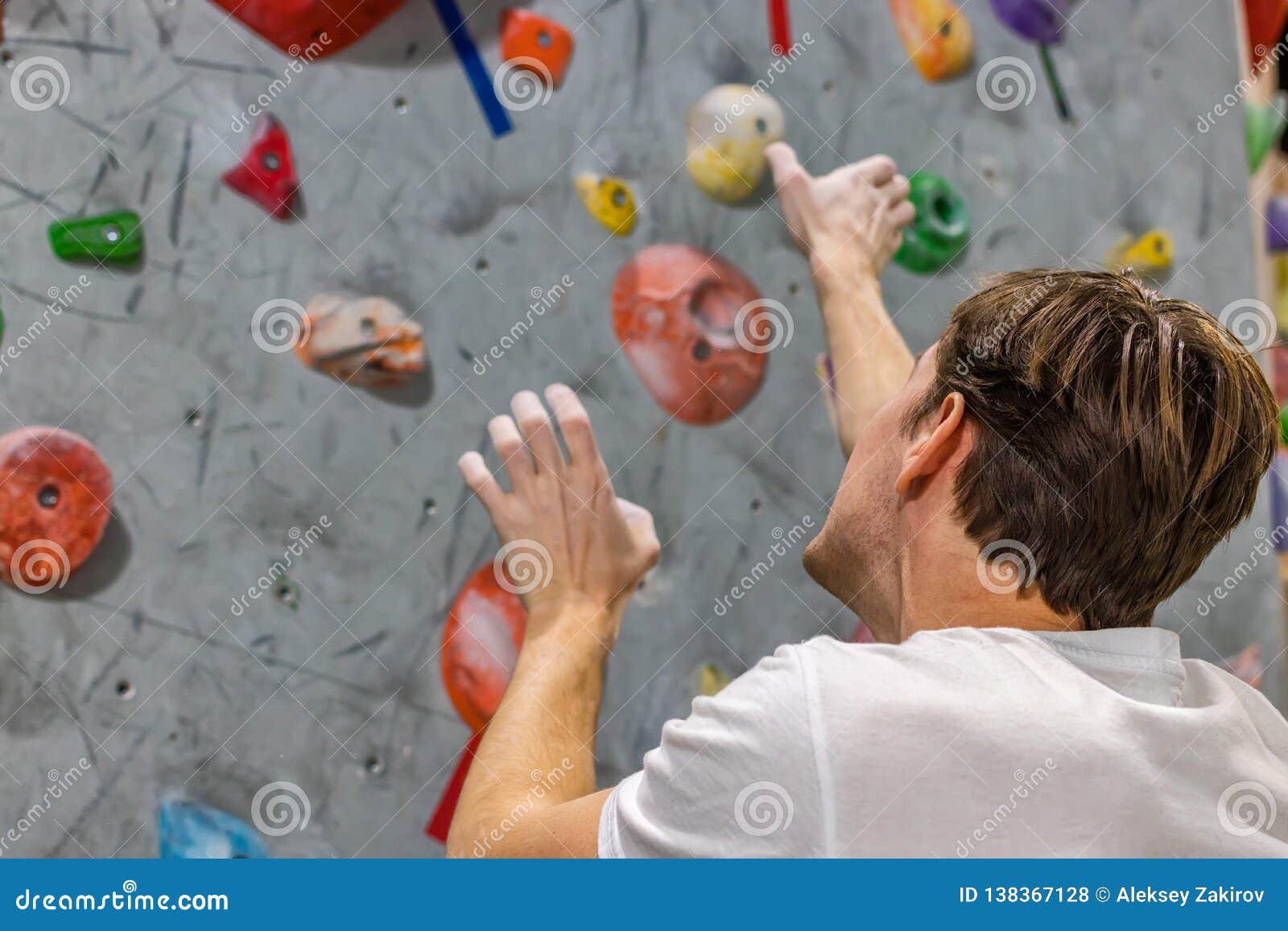 Climber Explores and Develops a Route on a Climbing Wall in the Boulder ...