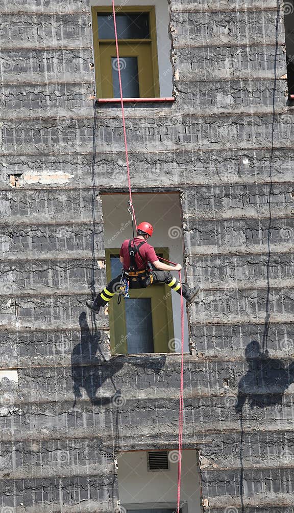 Climber Firefighter Rappelling the Wall during the Fire Drill Stock ...