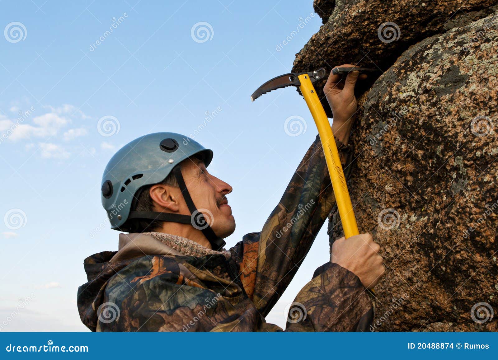 The Climber Hammers in Hook into Rock Stock Photo - Image of ...