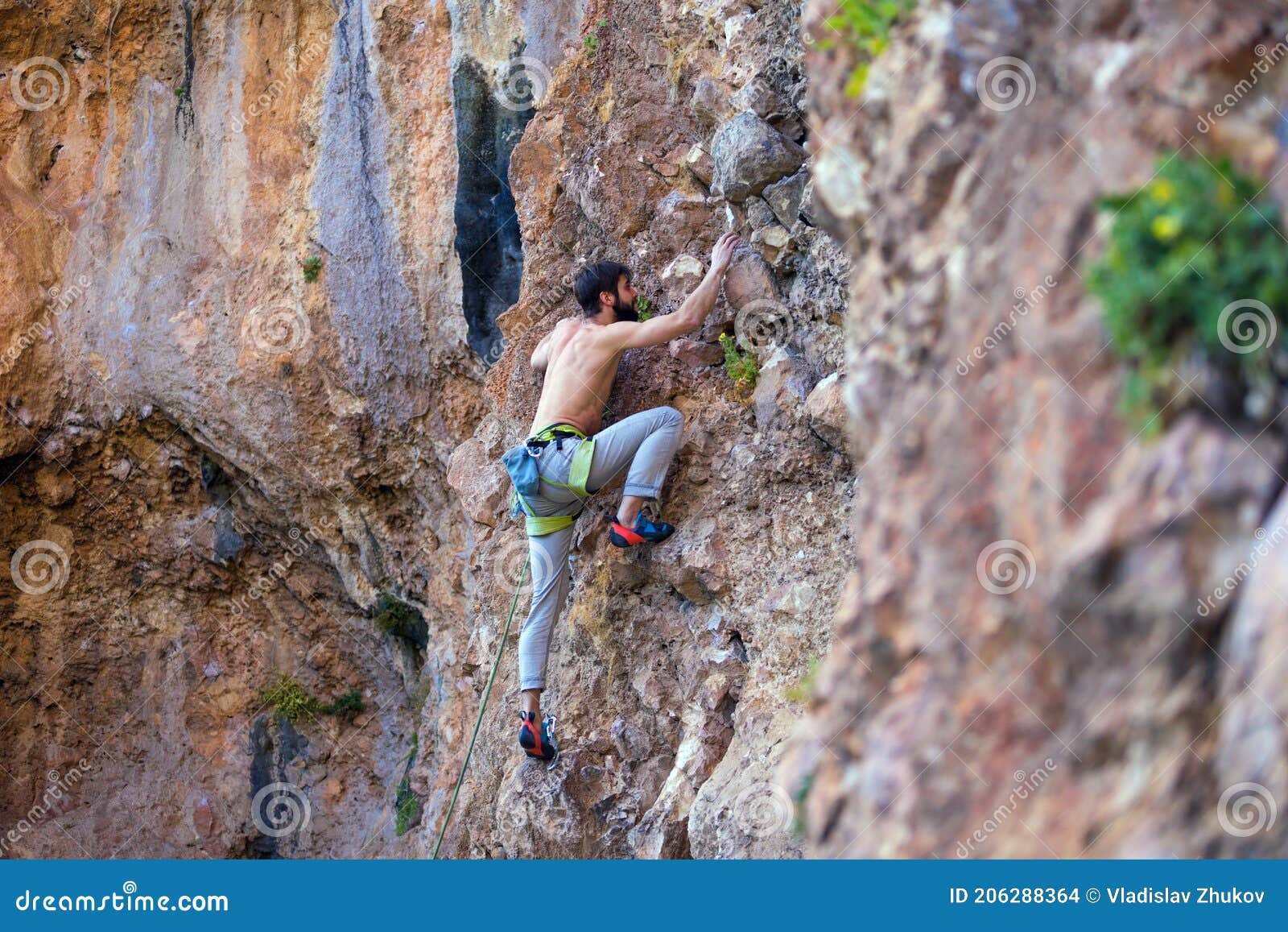 Climber Overcomes a Difficult Climbing Route on a Natural Terrain Stock ...