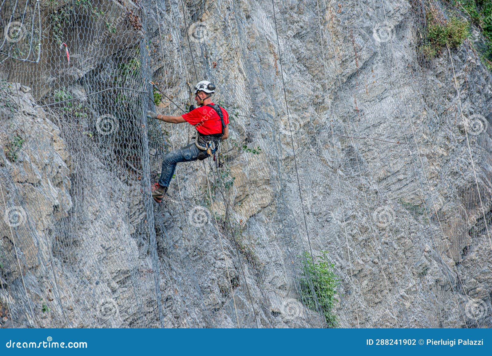 Climber Placing Safety Nets To Avoid Falling Rocks Editorial Photo ...