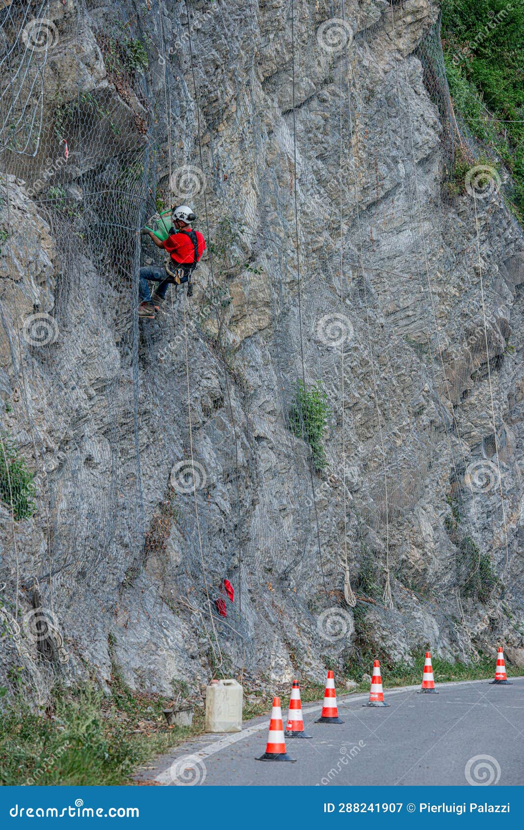 Climber Placing Safety Nets To Avoid Falling Rocks Editorial Photo ...