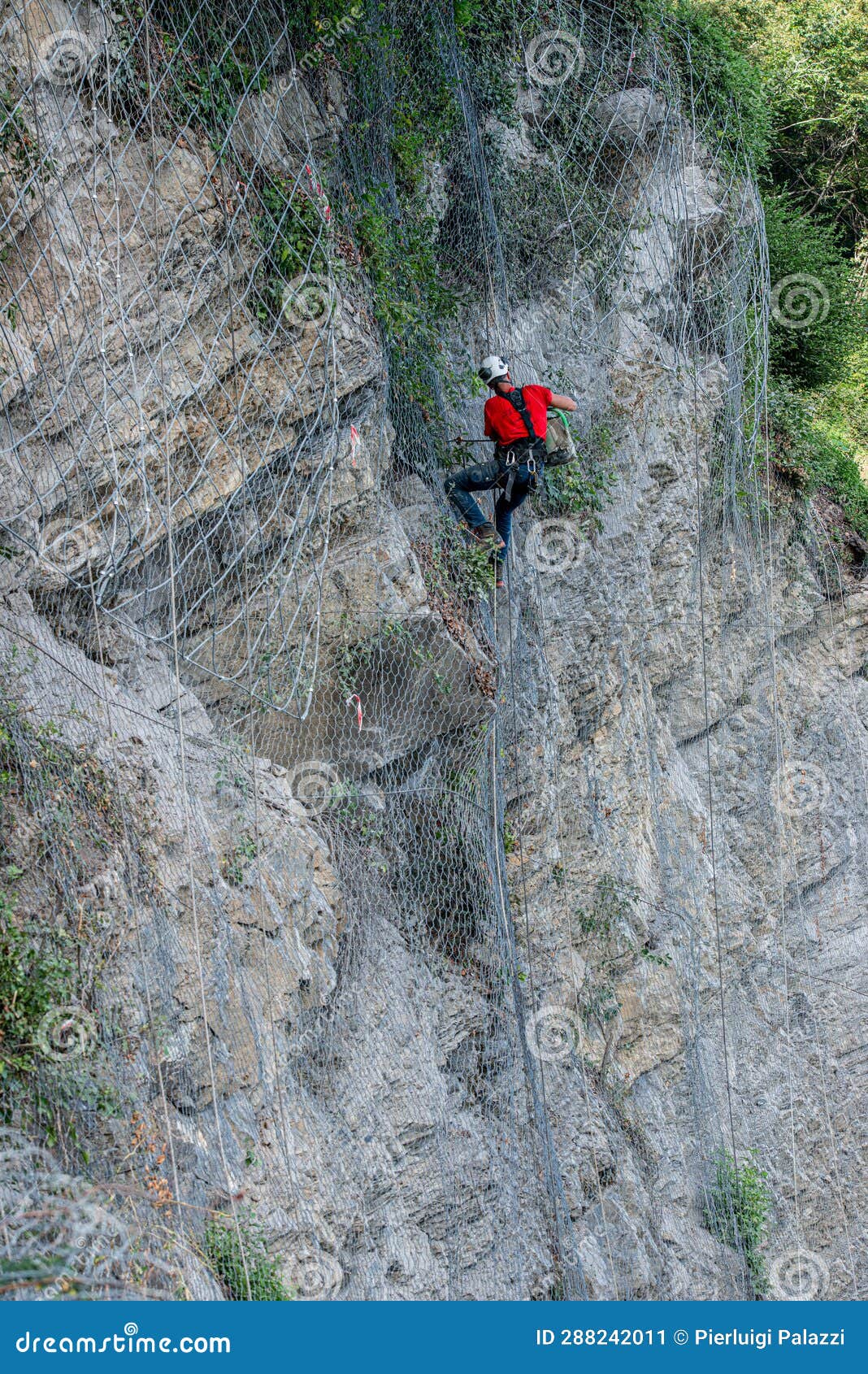 Climber Placing Safety Nets To Avoid Falling Rocks Editorial Photo ...