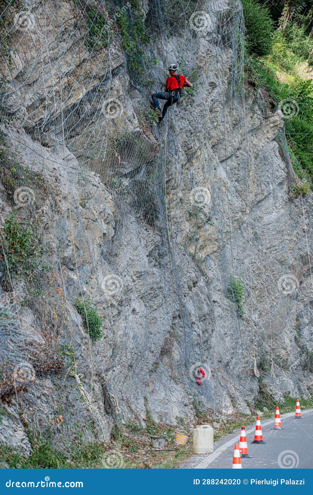 Climber Placing Safety Nets To Avoid Falling Rocks Editorial Image ...