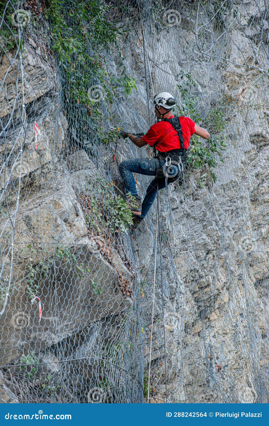 Climber Placing Safety Nets To Avoid Falling Rocks Editorial Photo ...