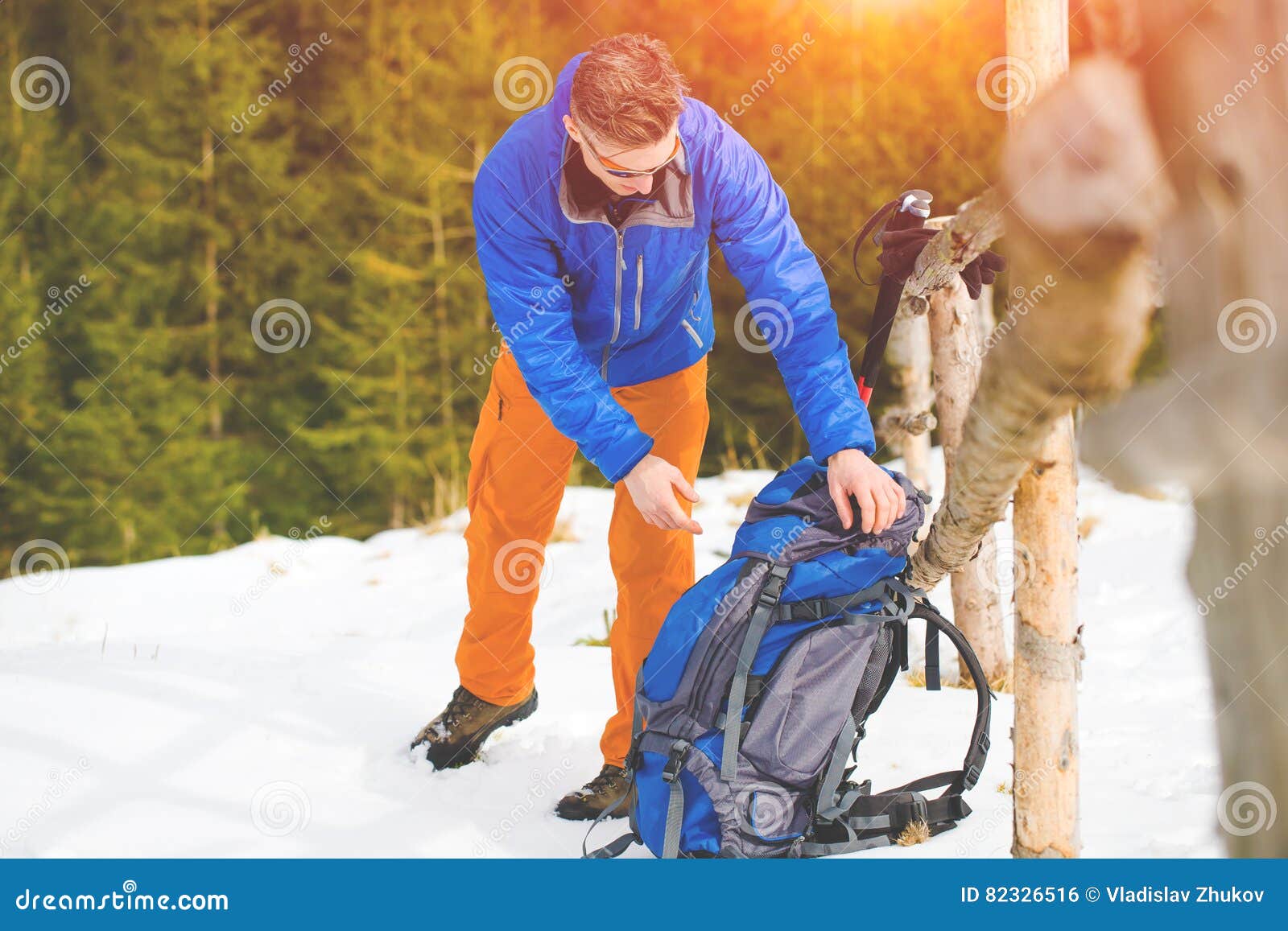 The Climber Pulls Things Out of the Backpack. Stock Photo - Image of ...