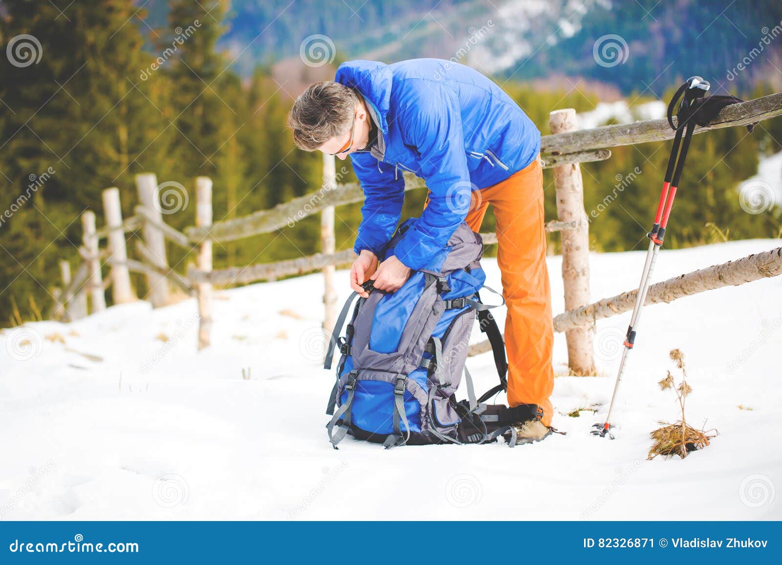 The Climber Pulls Things Out of the Backpack. Stock Image - Image of ...