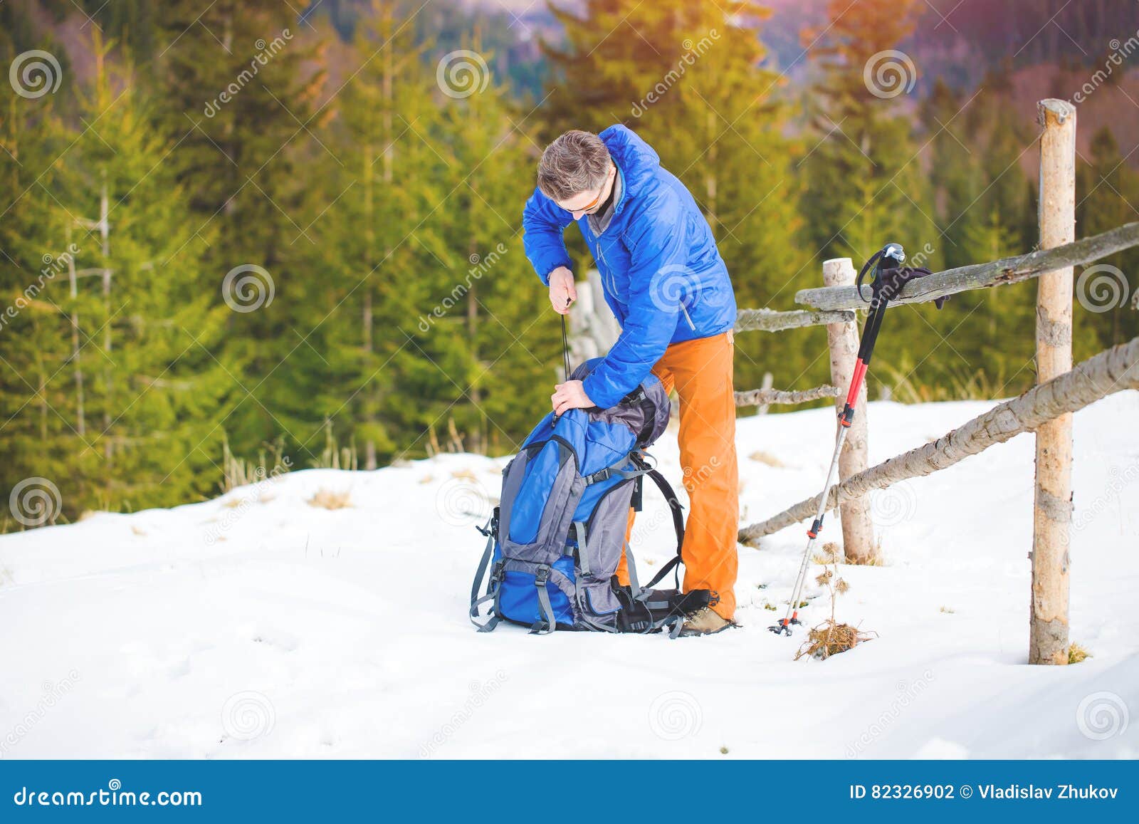 The Climber Pulls Things Out of the Backpack. Stock Photo - Image of ...