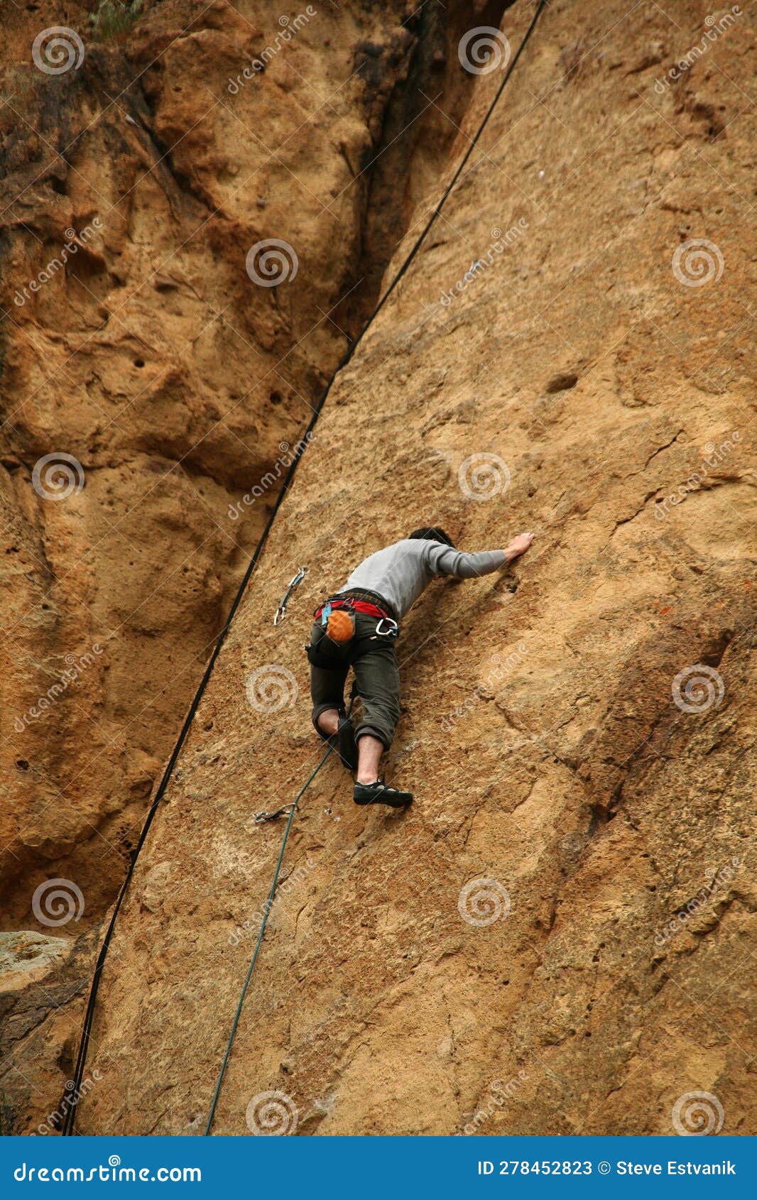 Climber on sheer rock face stock image. Image of climbing - 278452823