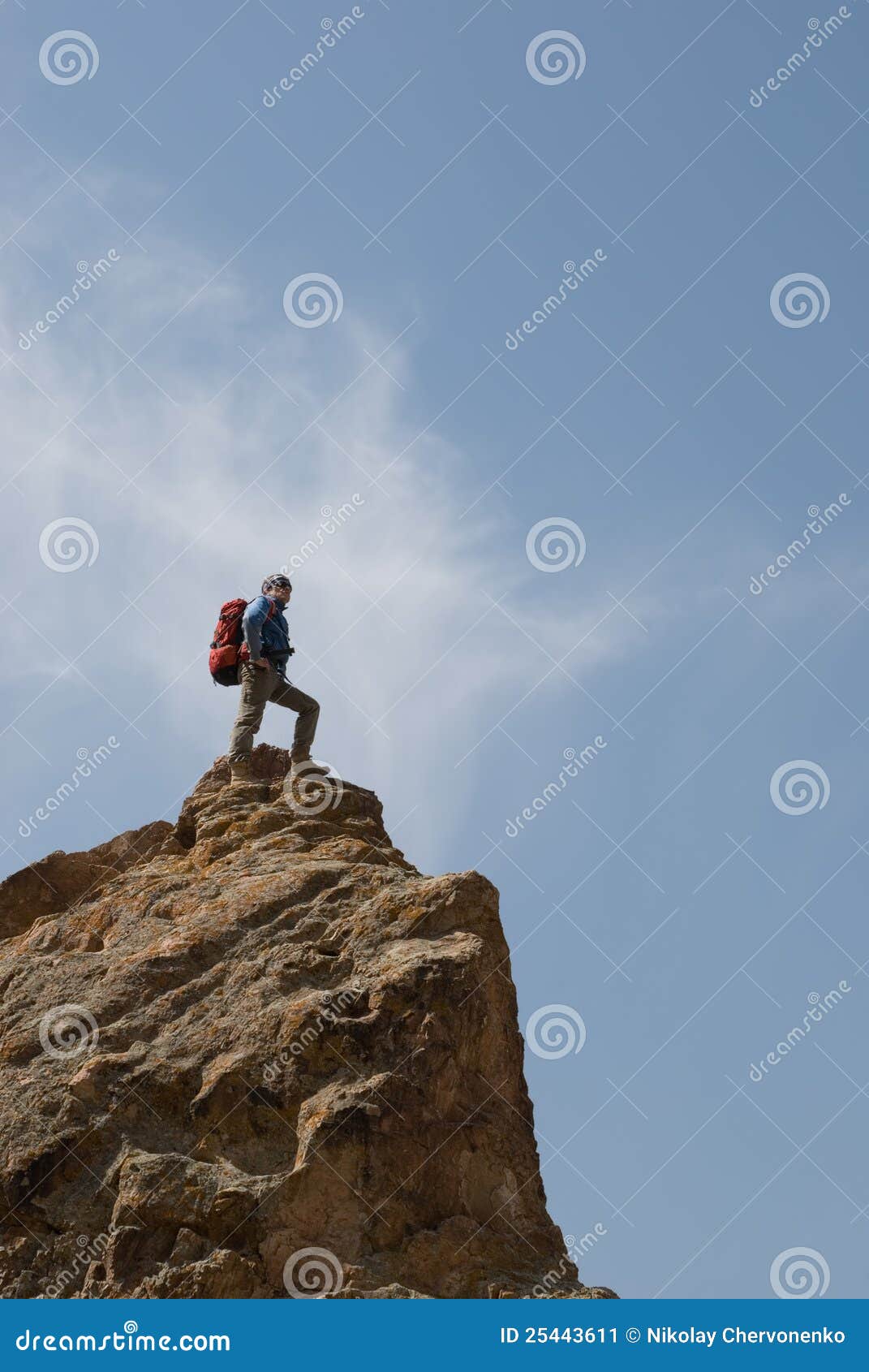 Climber stands at top stock image. Image of alpinism - 25443611
