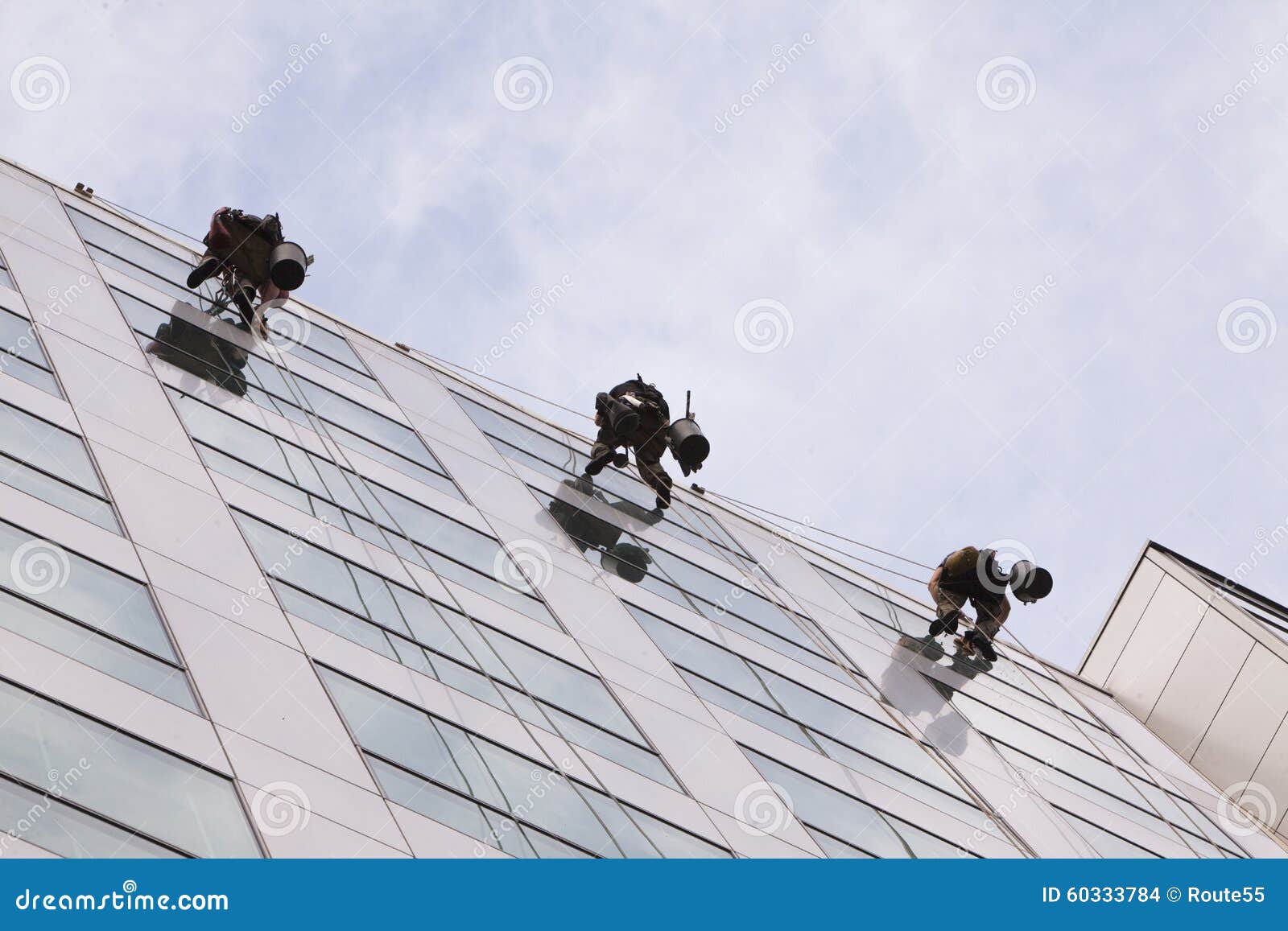 Climbers clean the windows stock photo. Image of climbing - 60333784