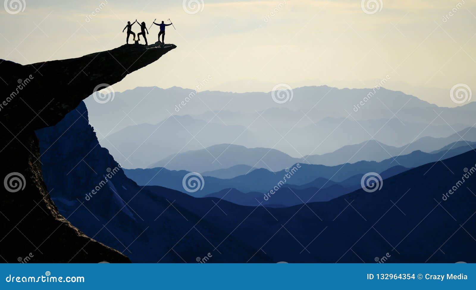 Climbers on Edge of Mountain Summit Stock Photo - Image of people ...
