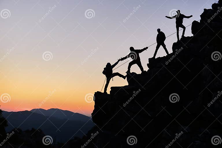 Climbers working together stock photo. Image of cliff - 104269714