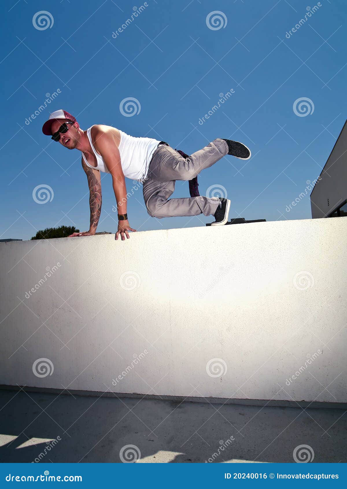 Climbing over a walll stock photo. Image of escape, kick - 20240016