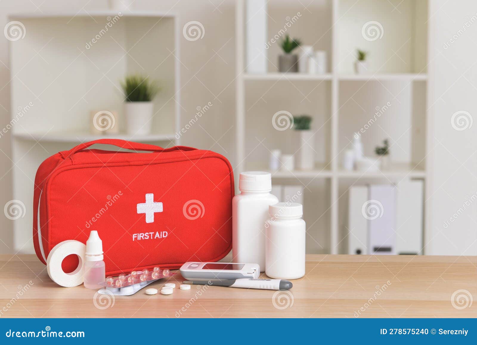 First Aid Kit on Table in Clinic Stock Photo - Image of clinic ...