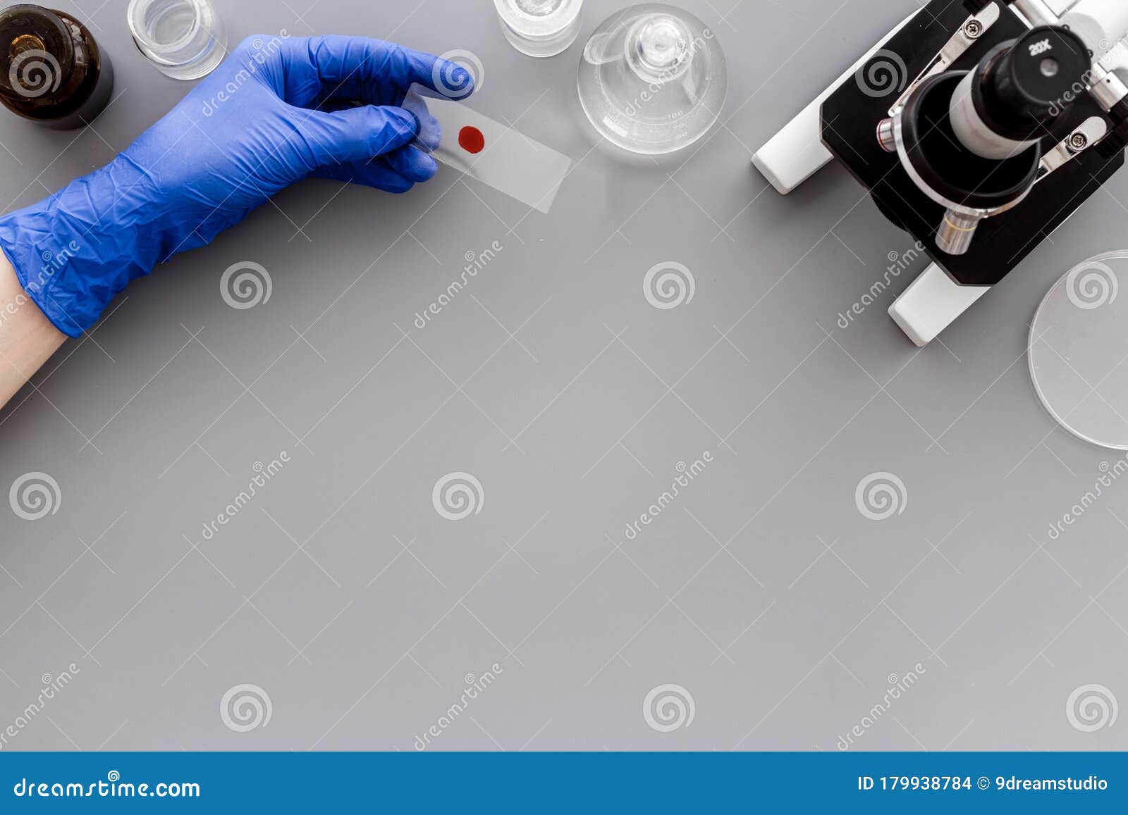 Clinical Science Research with Microscope. Hand Holds Blood Sample on ...