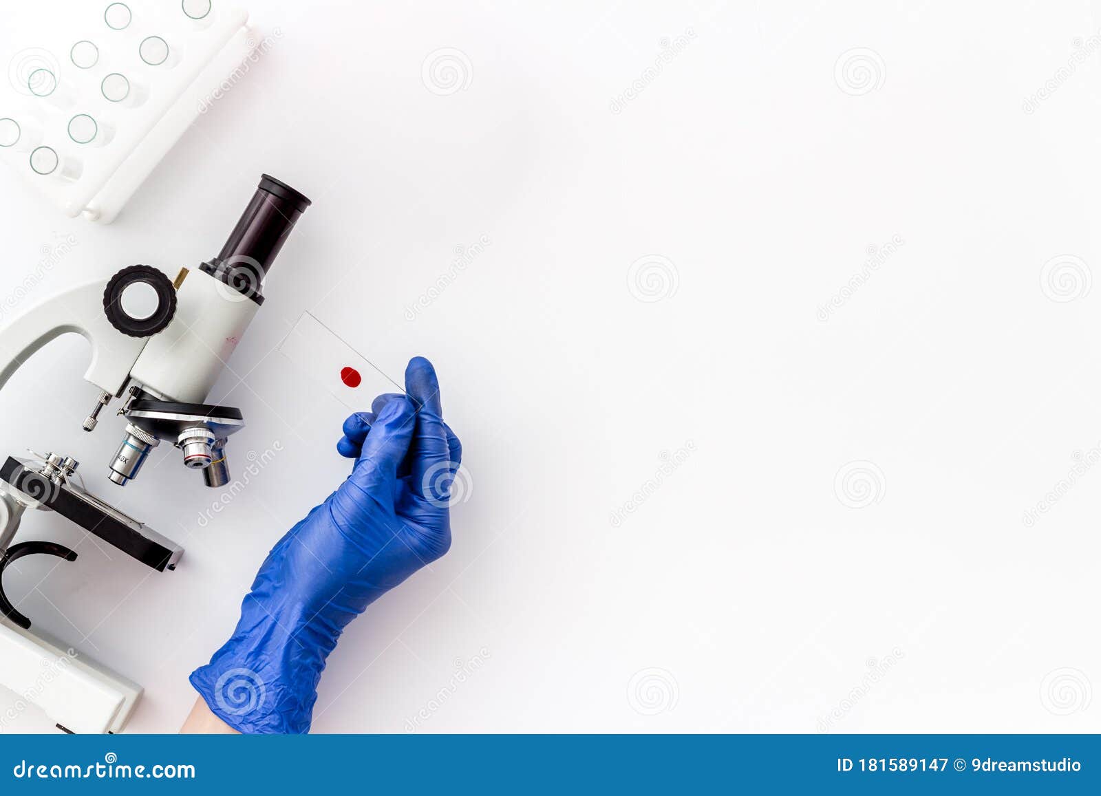 Clinical Science Research with Microscope. Hand Holds Blood Sample on ...