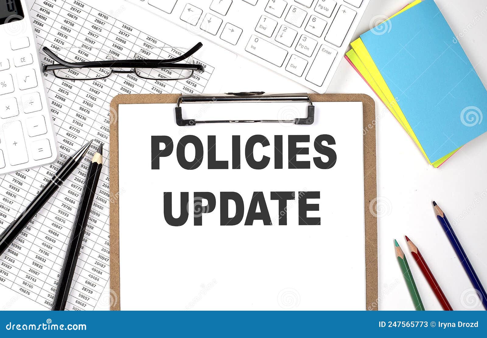 Clipboard with Text POLICIES UPDATE and Keyboard and Chart on White ...