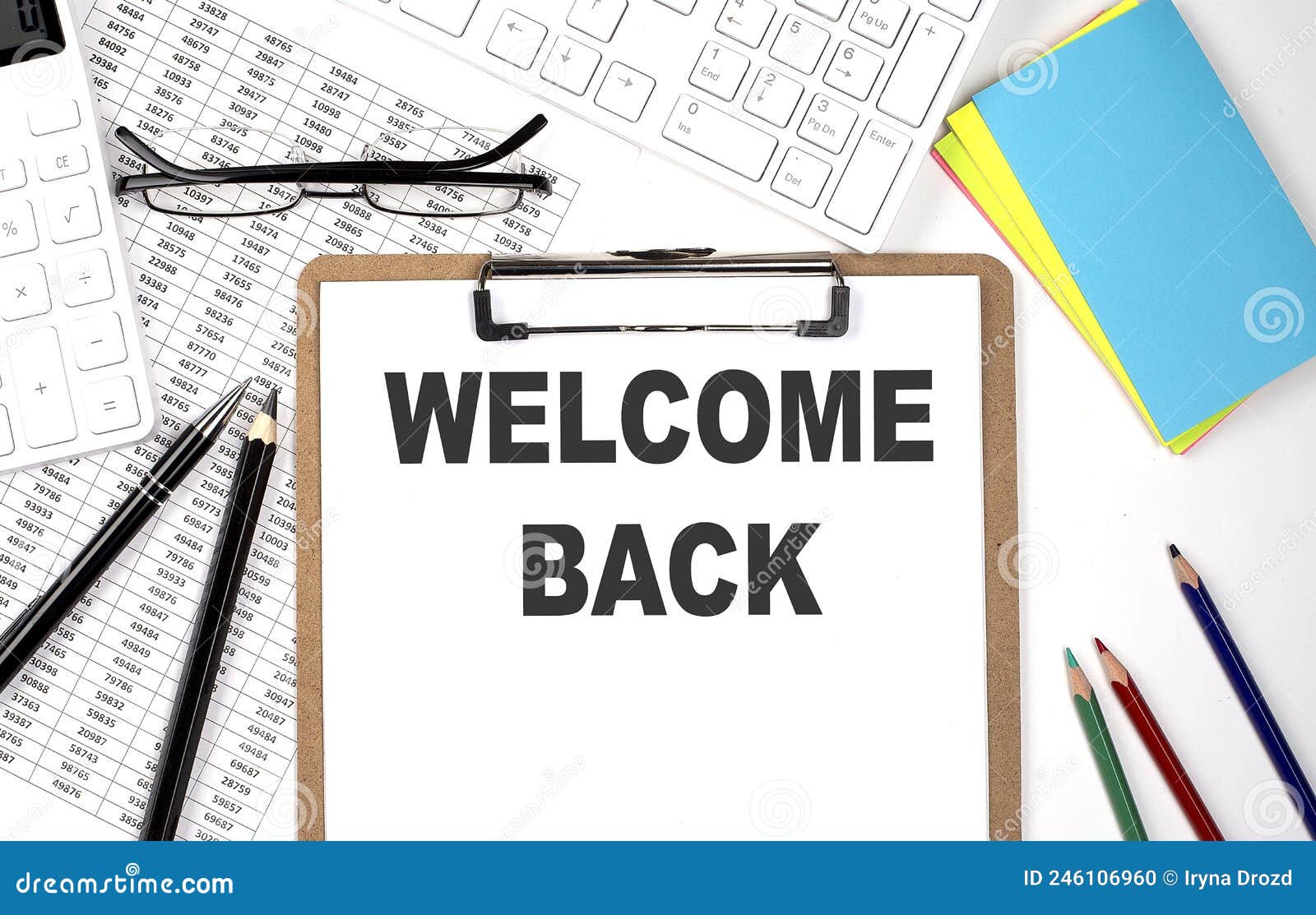 Clipboard with Text WELCOME BACK and Keyboard and Chart on the White ...