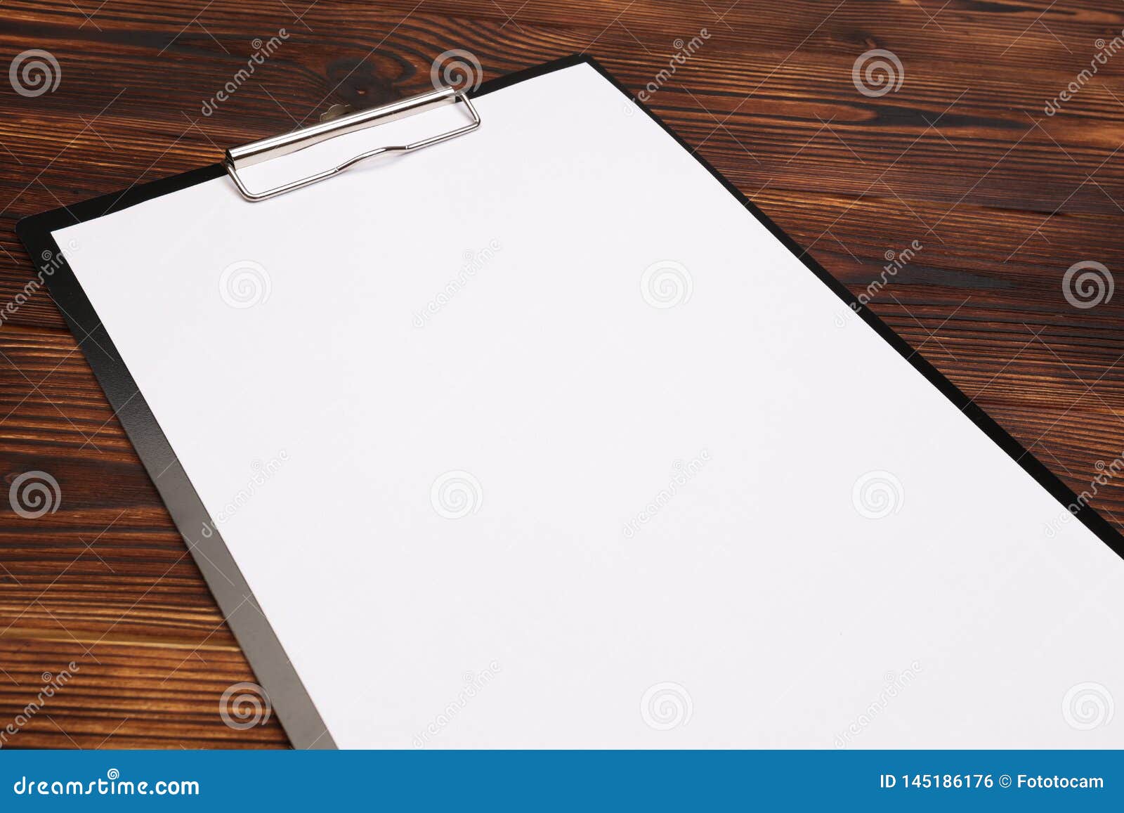 Clipboard with White Sheet on Wood Background. Top View Stock Photo ...