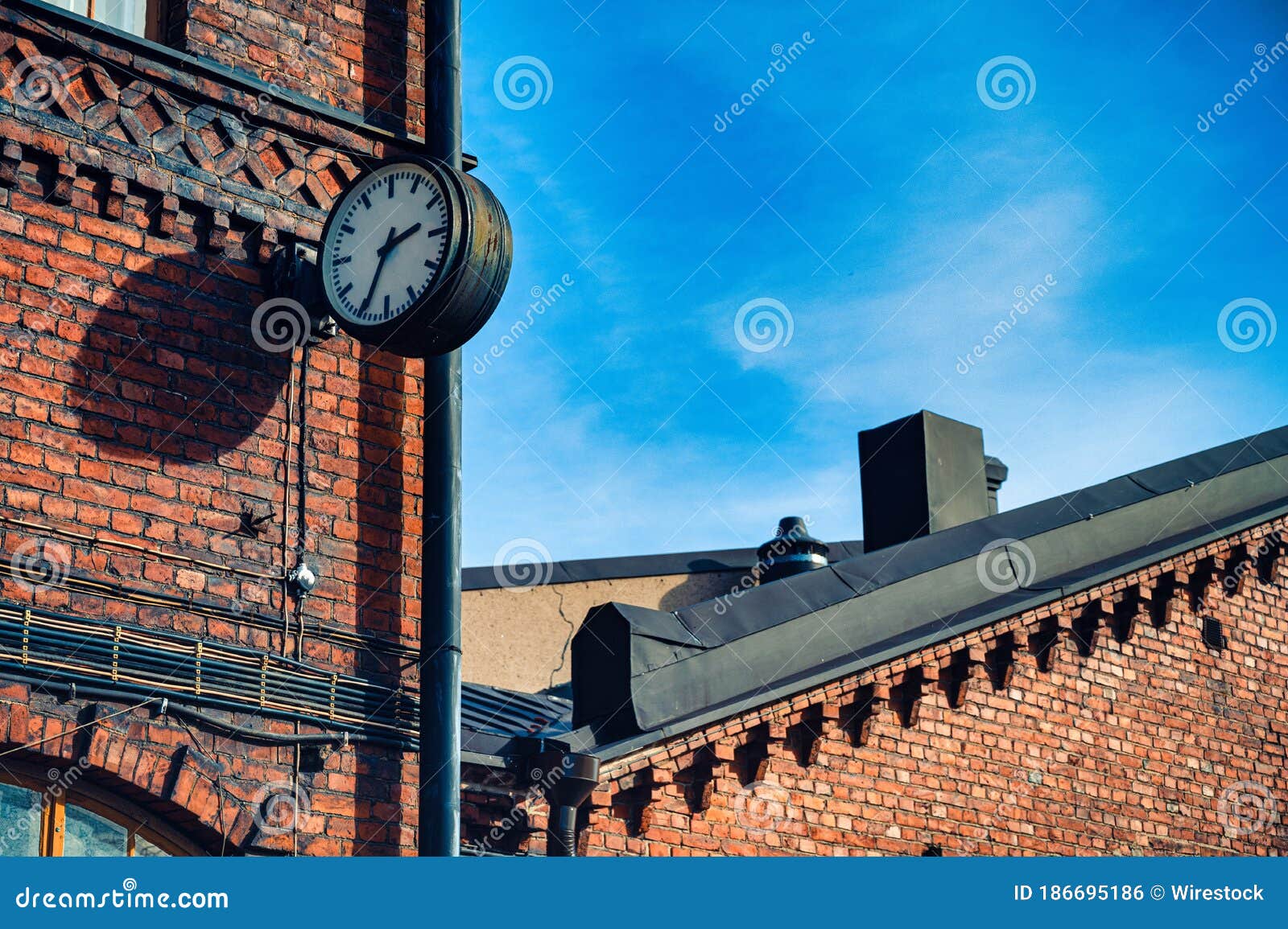 Clock Attached To a Building Made of Bricks Stock Photo - Image of late ...