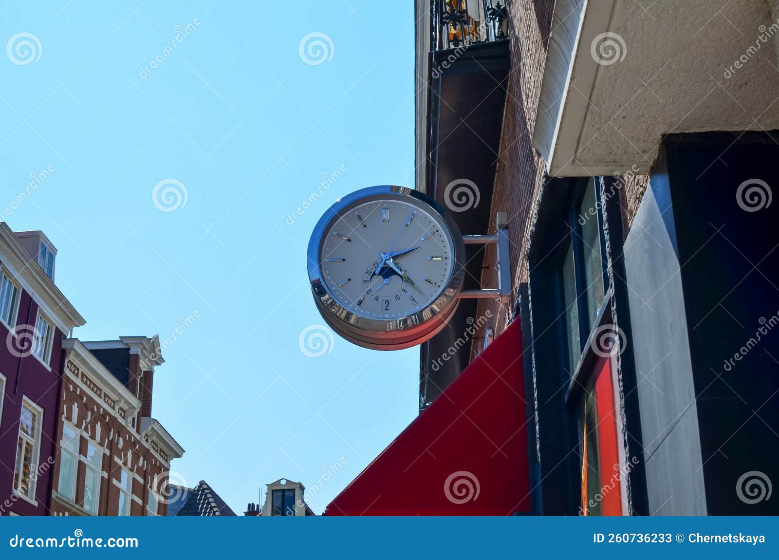 Clock Attached To Modern Building in City on Sunny Day Stock Image ...