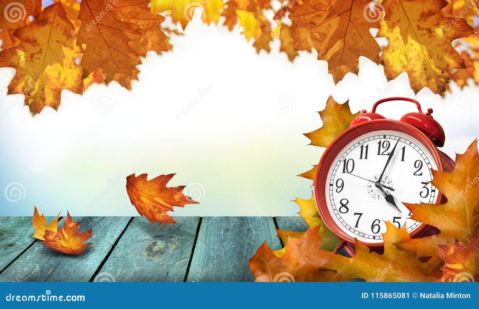 Clock and Autumn Leaves on Wooden Table - Daylight Saving Time C Stock ... Clock and Autumn Leaves on Wooden Table - Daylight Saving Time C Stock ...