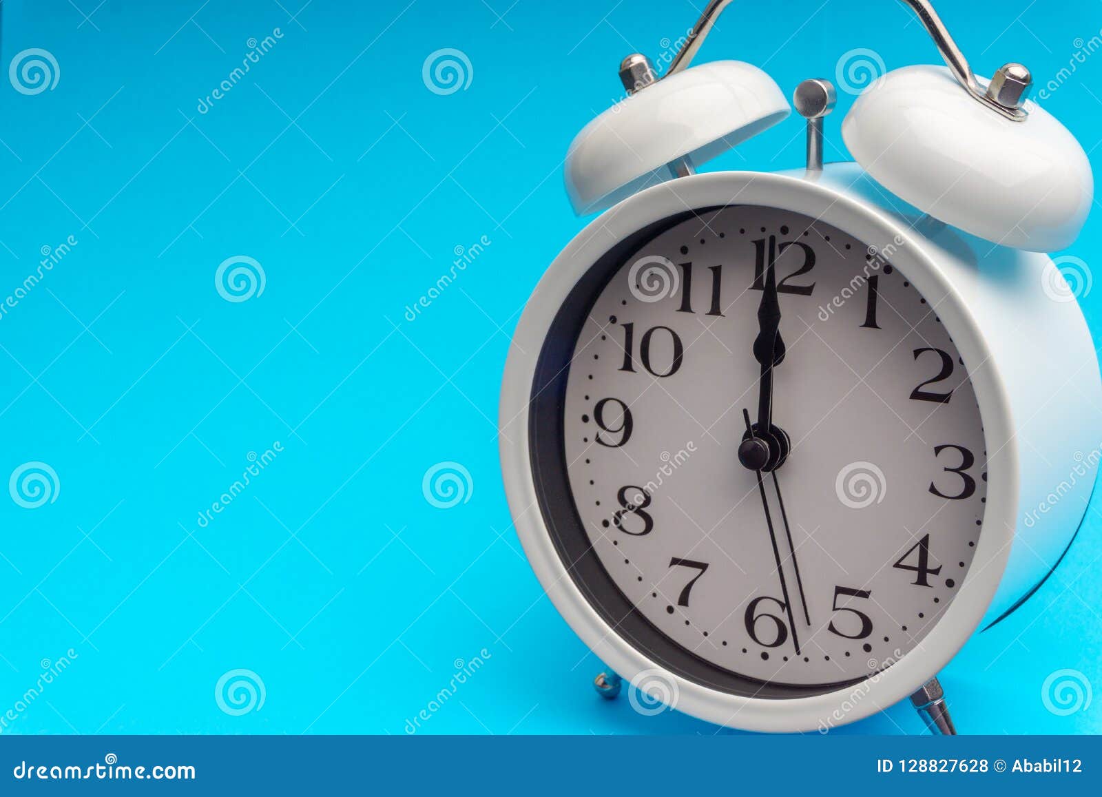 Clock on blue background stock photo. Image of color - 128827628