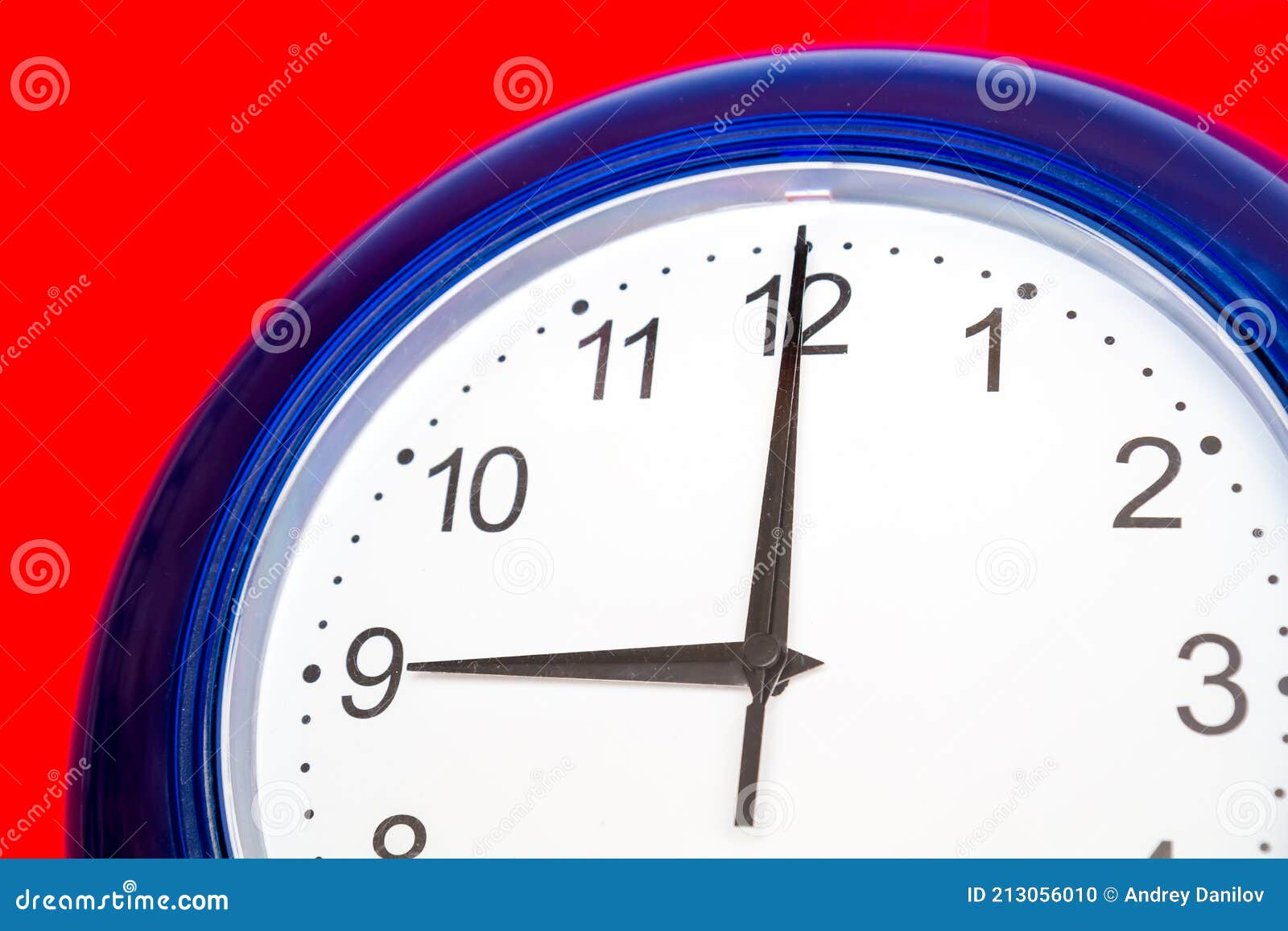 Clock with a Blue Frame on a Red Background, Nine Hours on the Dial ...