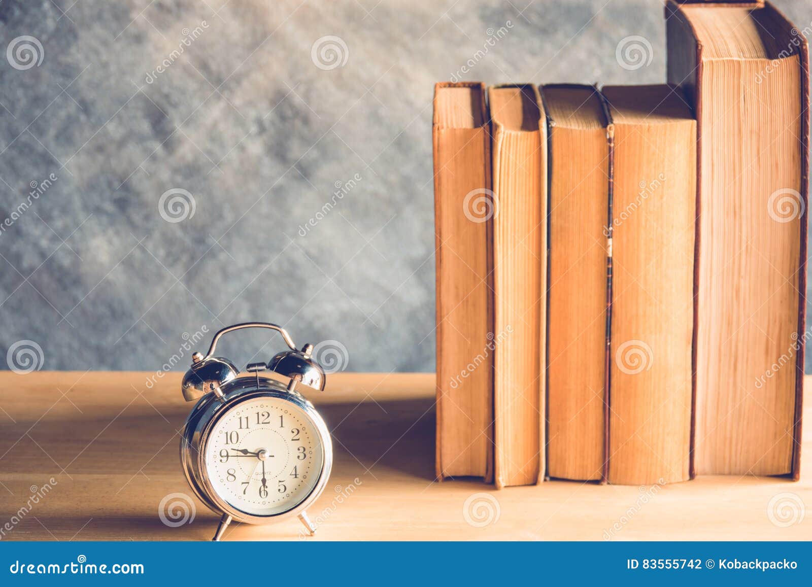 Clock and book stock photo. Image of awake, silver, hour - 83555742
