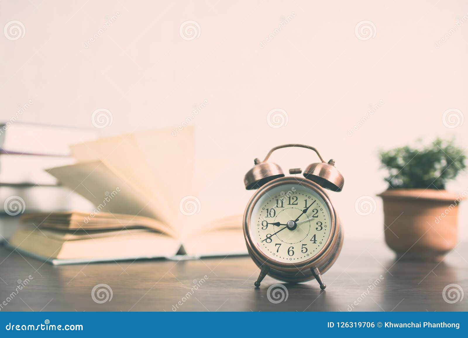 Clock and Books on Table for Time To Learning and Knowledge Concept ...