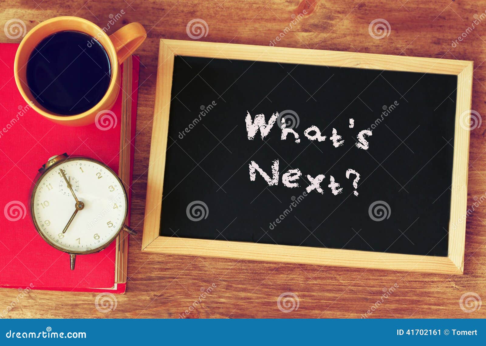 Clock, Coffee, and Blackboad with the Phrase Whats Next? Written on it ...