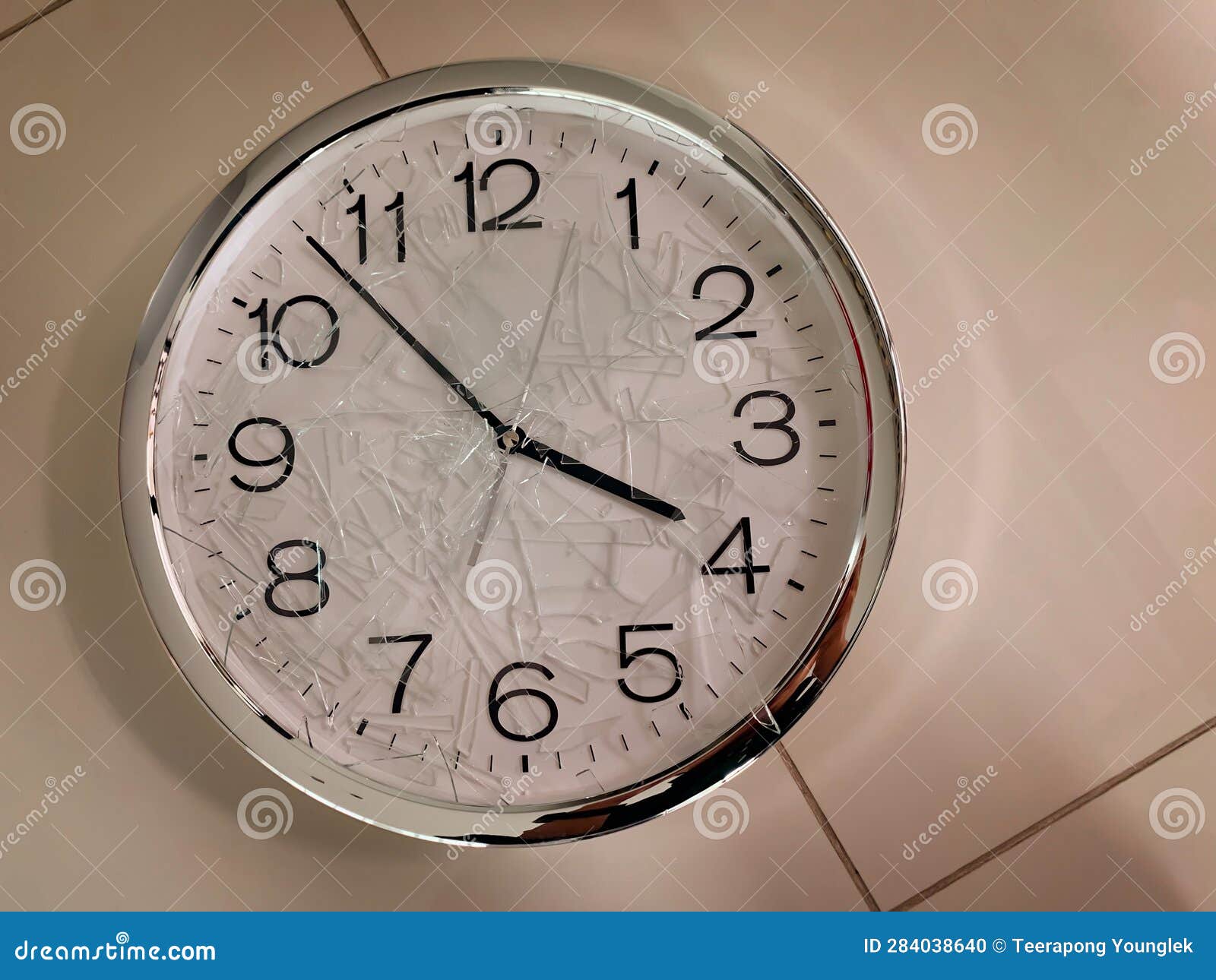 A Clock with Cracked and Shattered Glass Lay on the Floor Stock Photo ...