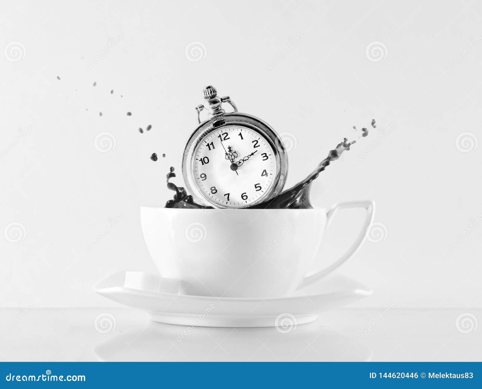 Clock and cup of coffee stock photo. Image of splashes - 144620446