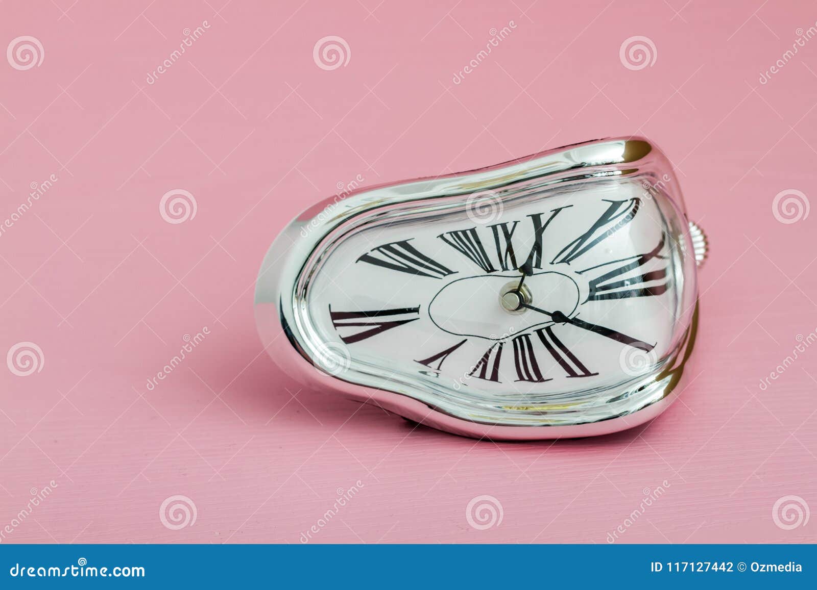 Clock with Distorted Soft Melting Design on Pink Background Stock Photo ...