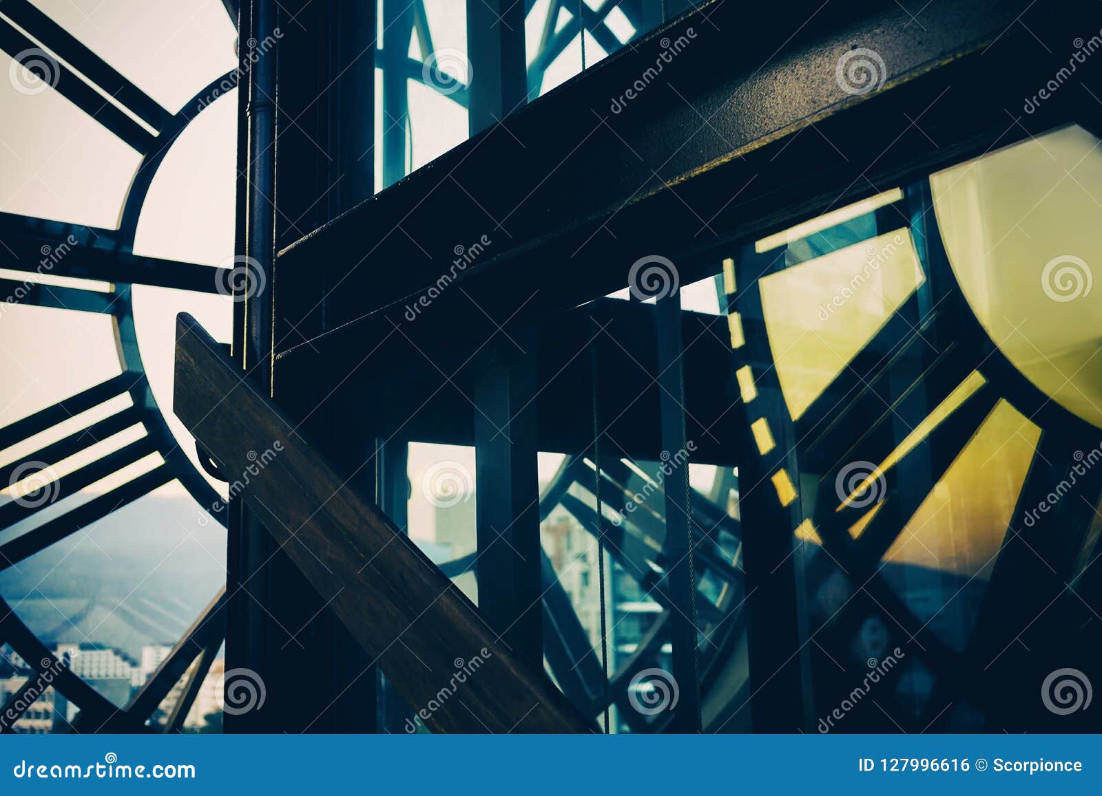 Clock Face Reflection in Glass Above City. Blue and Yellow. Sunset ...