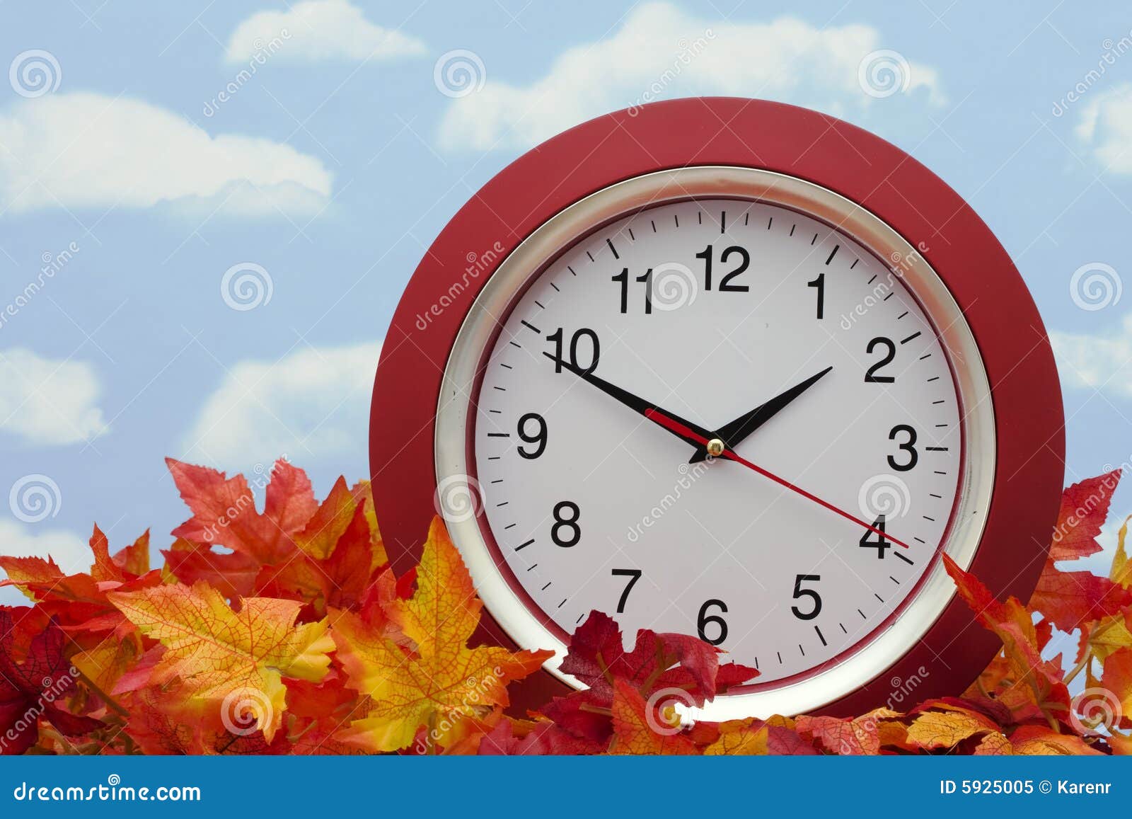 Clock on Fall Leaves stock image. Image of space, blue - 5925005