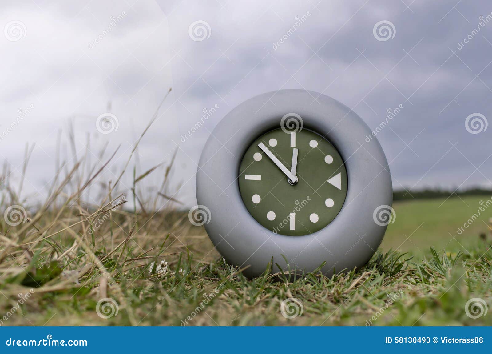 Clock in a Field stock photo. Image of object, shallow - 58130490