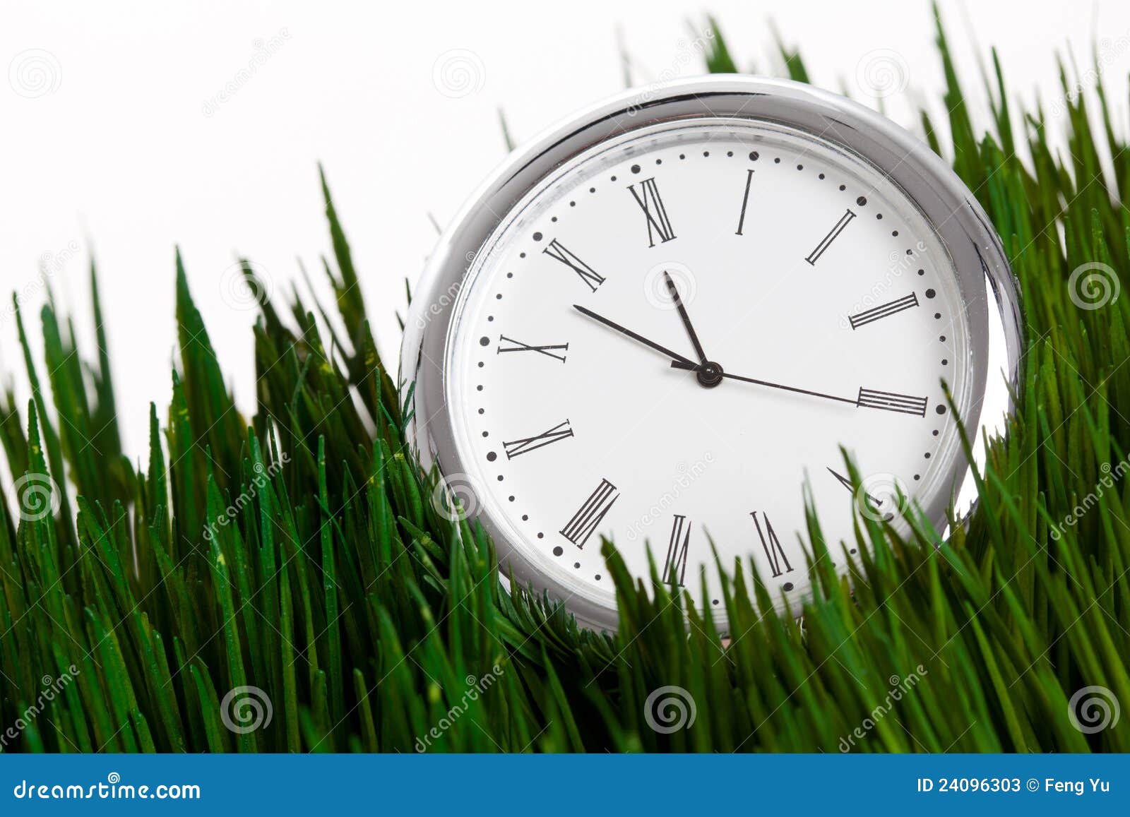 Clock and green grass stock image. Image of lawn, spring - 24096303