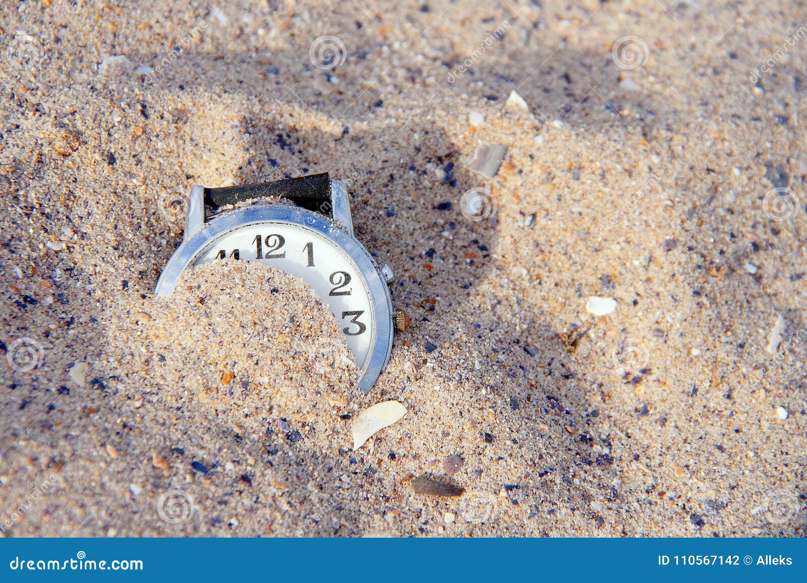 The Clock is Half Buried in the Sand on the Beach. Stock Photo - Image ...