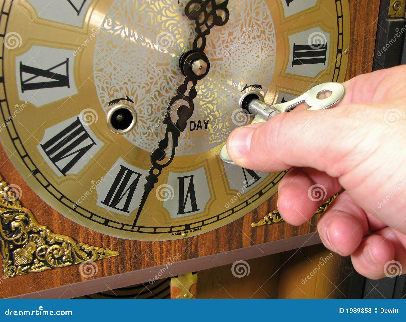 Clock and Hand stock photo. Image of large, white, winding - 1989858