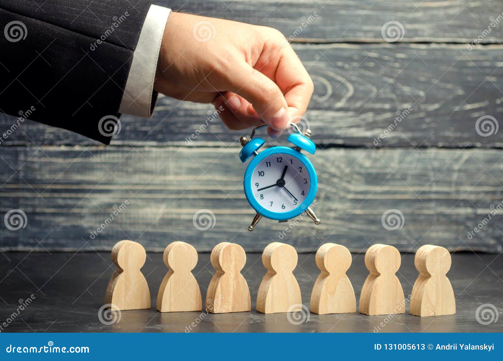 The Clock in the Hands of a Businessman and Team. Overtime Increase ...