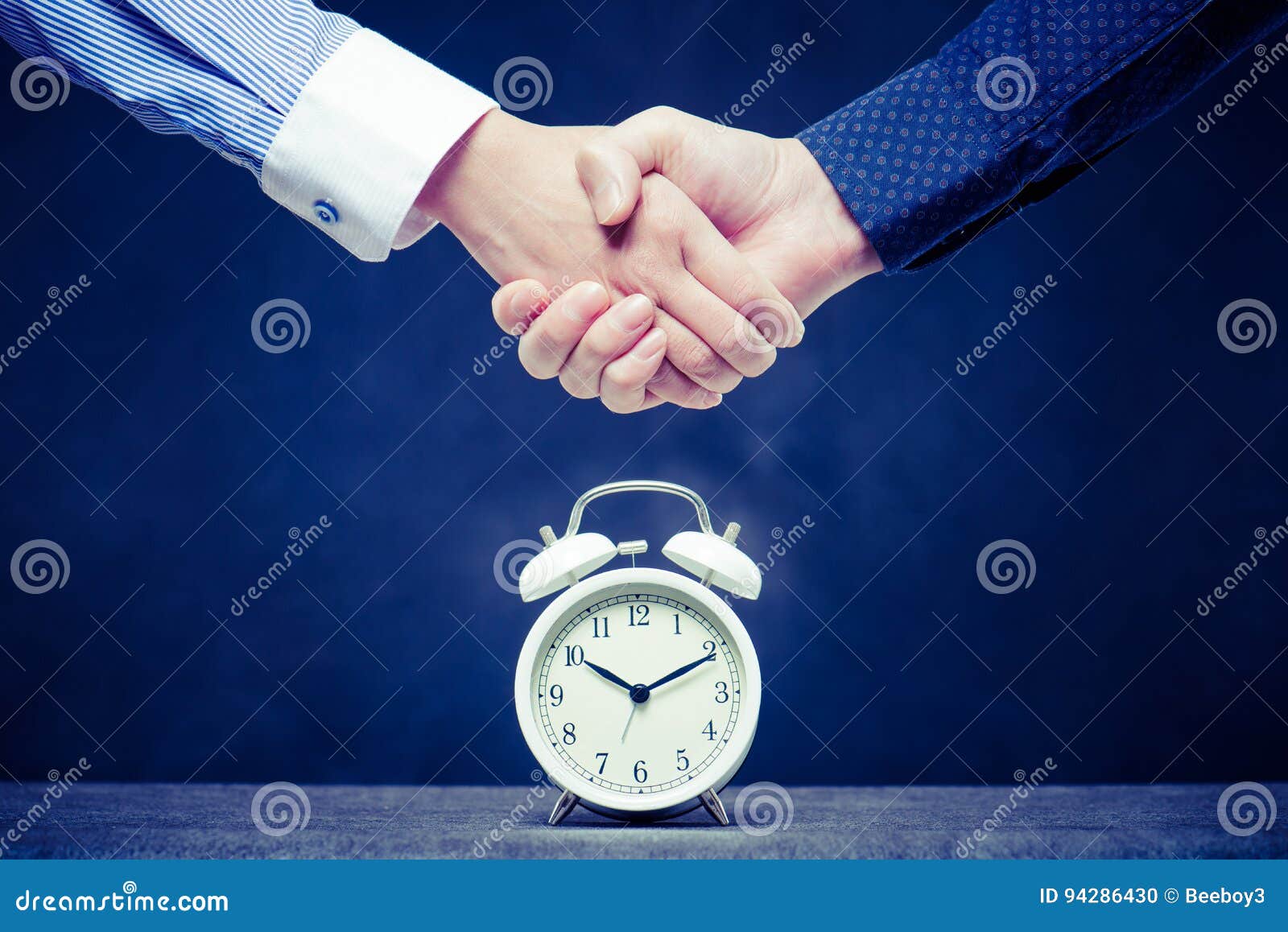 Clock and Handshake on Table Stock Photo - Image of clock, legal: 94286430