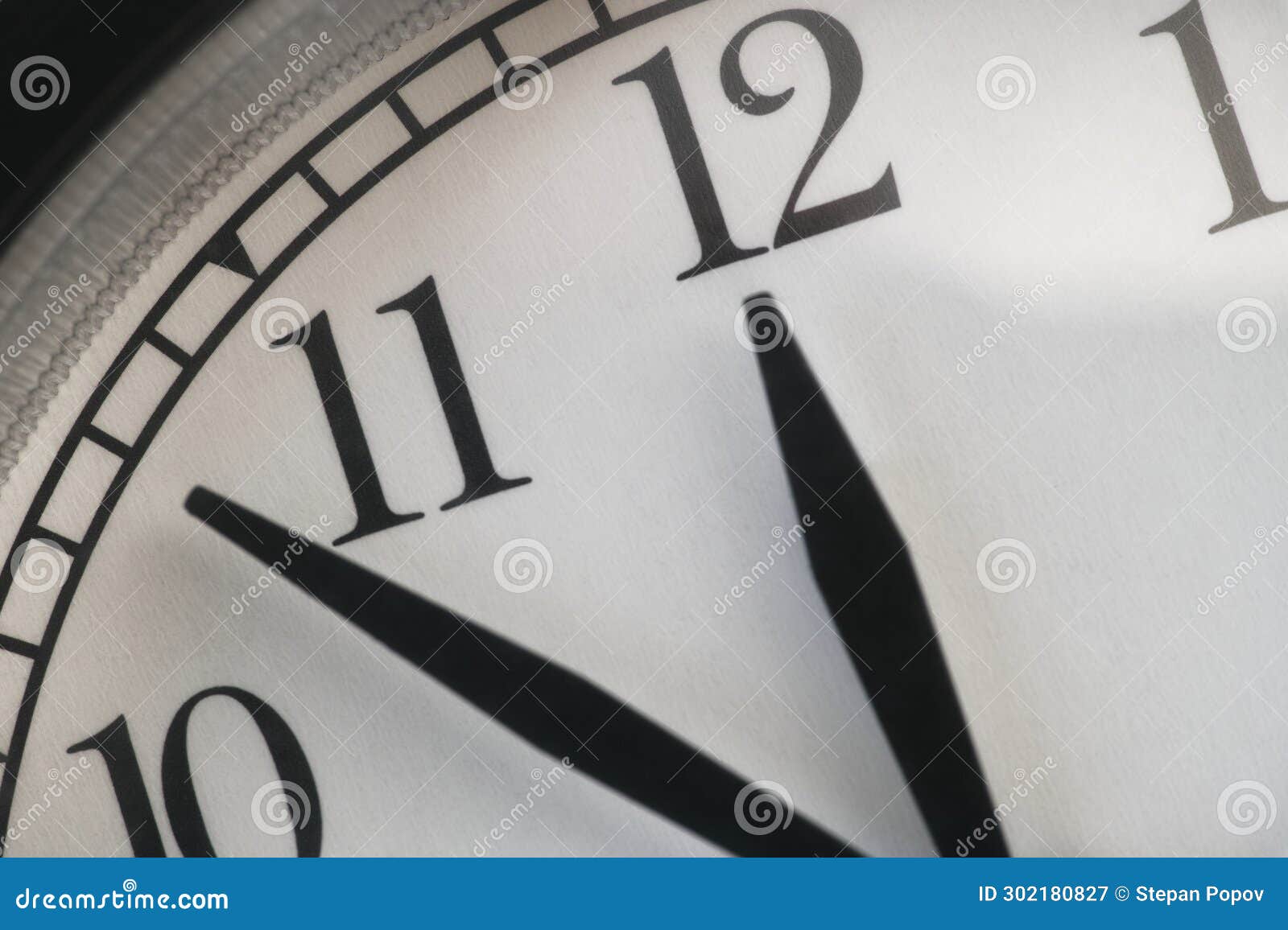 A Clock with the Hour Hand Pointing at Twelve and the Minute Hand ...