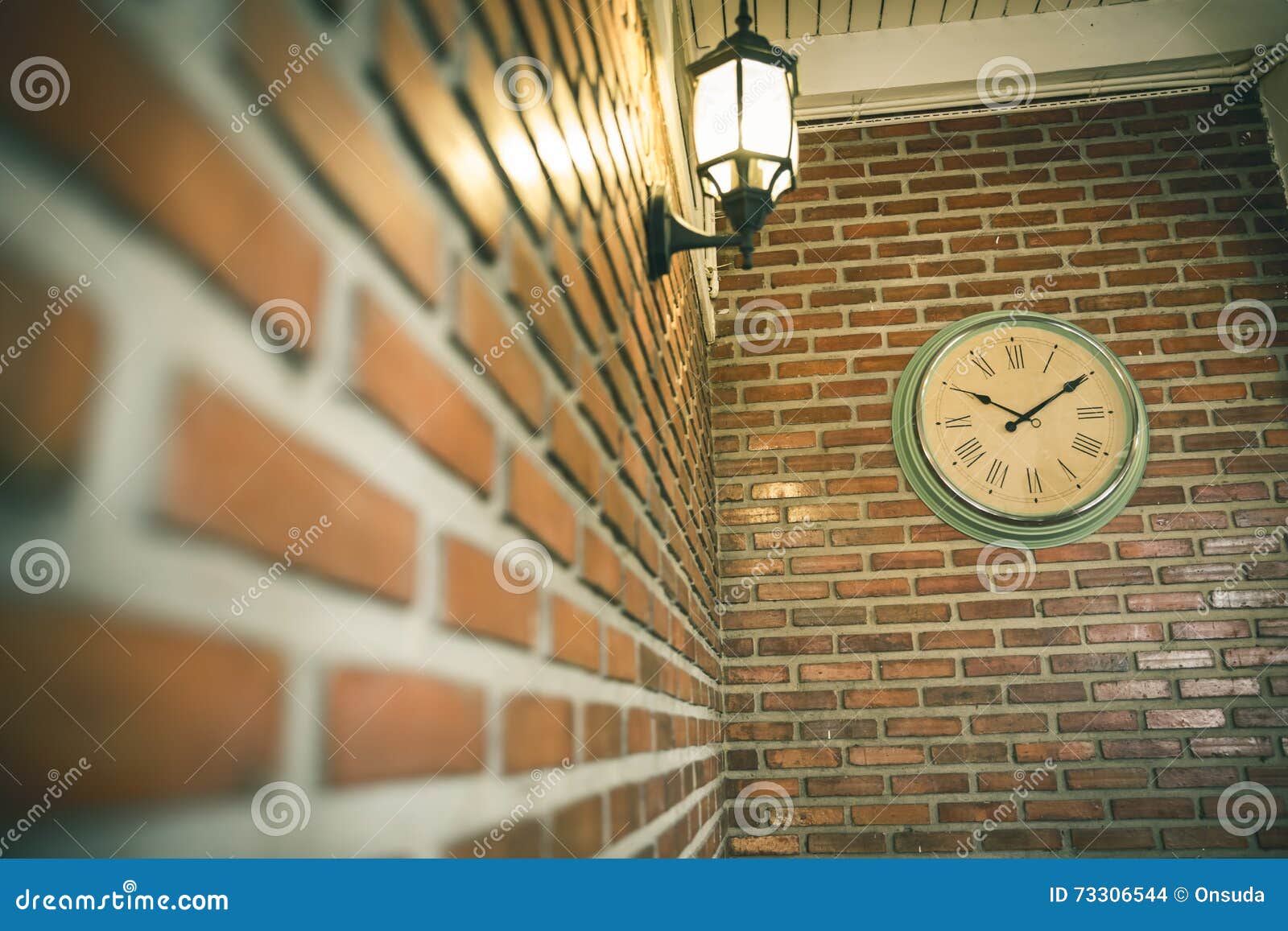 Clock and Lamp on Brick Wall Stock Photo - Image of texture, minute ...
